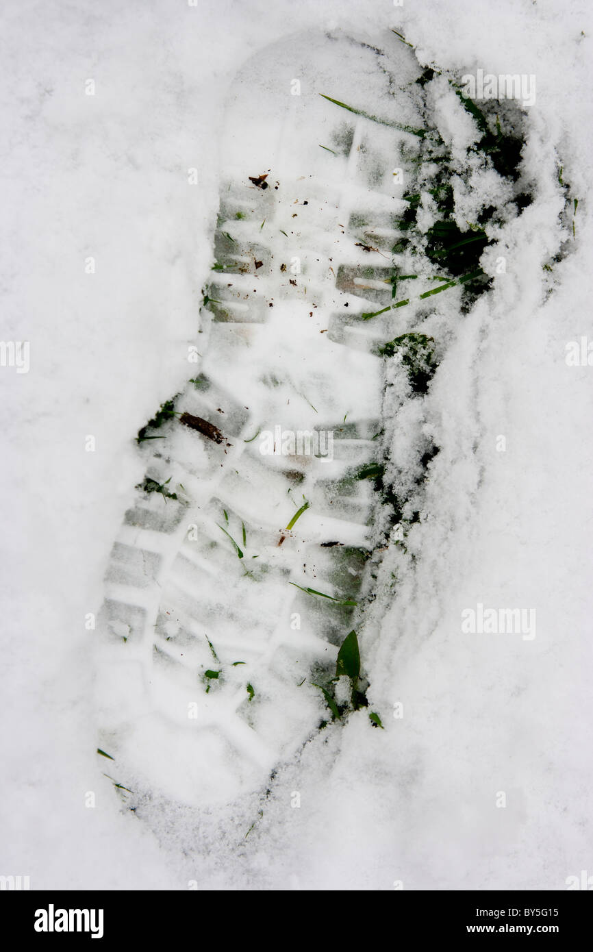 Footprint in snow Stock Photo - Alamy
