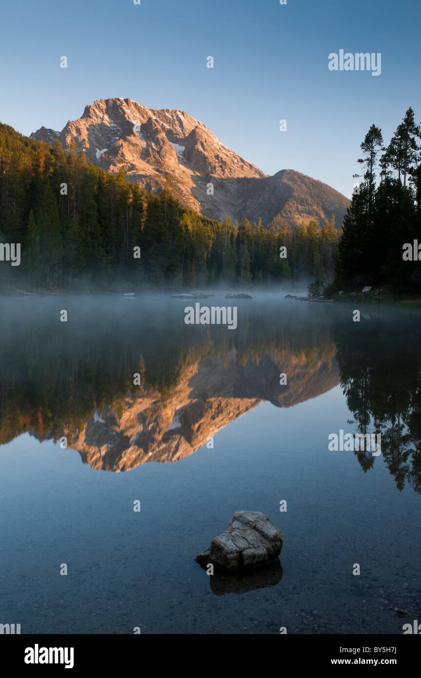 Peak of fall trees and their reflection on lake hi-res stock ...