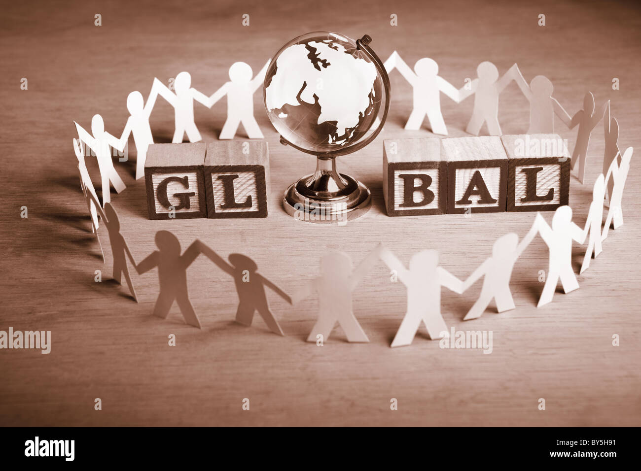Word 'Global' made of alphabet wooden block and a globe surrounded by ...