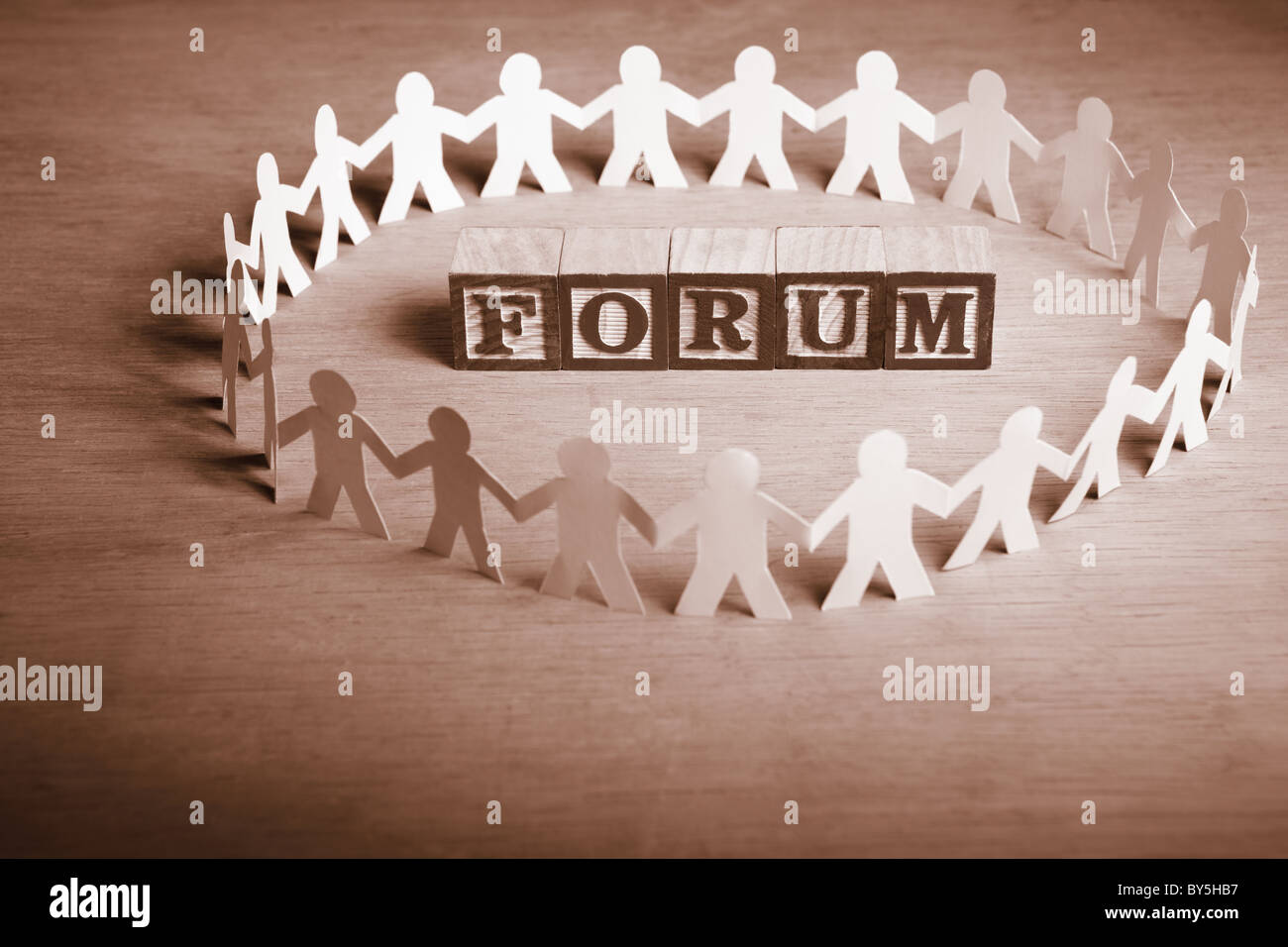 Word 'Forum' surrounded by people paperdolls Stock Photo - Alamy