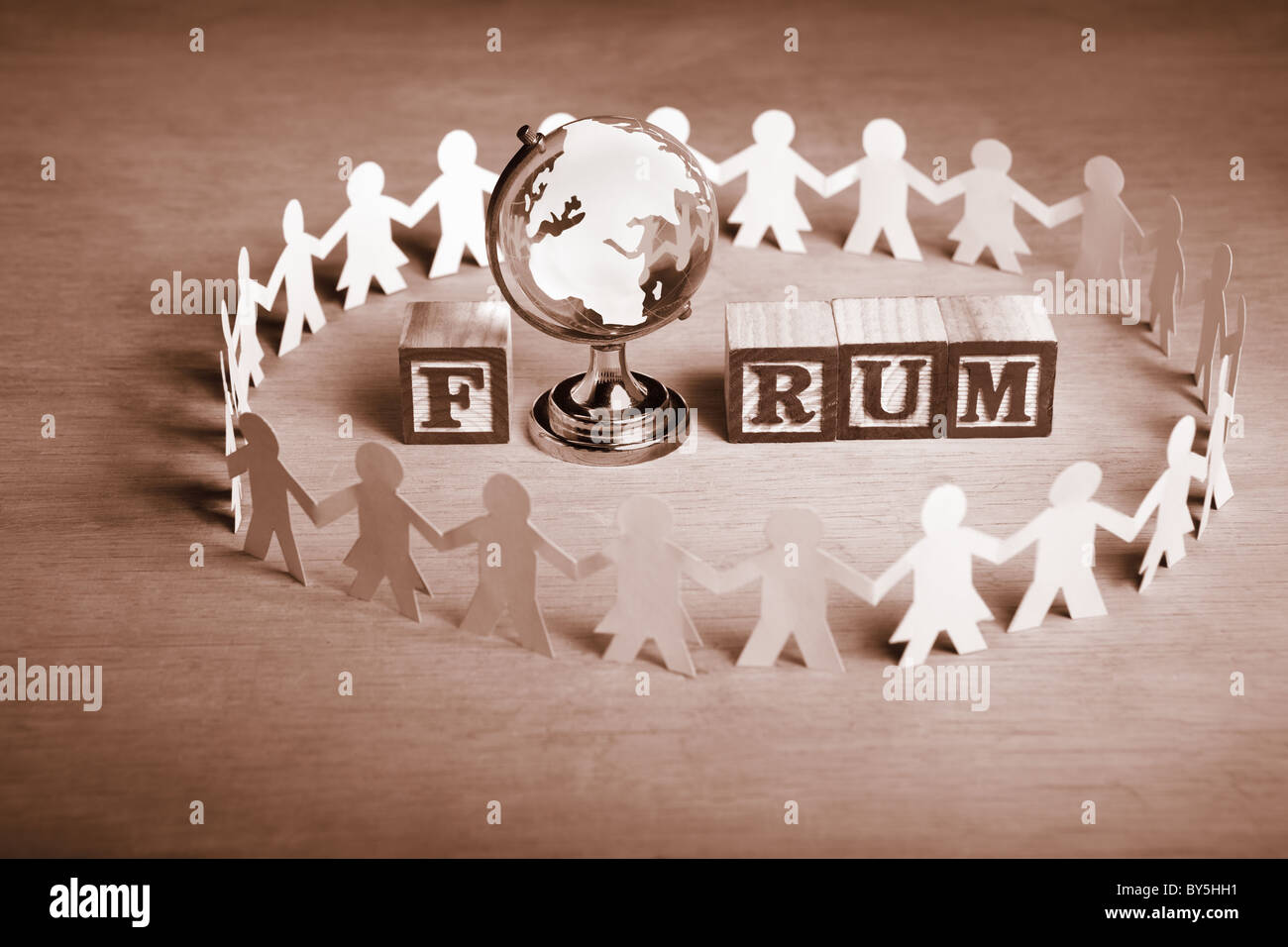 Word 'Forum' made of alphabet wooden block and a globe surrounded by ...