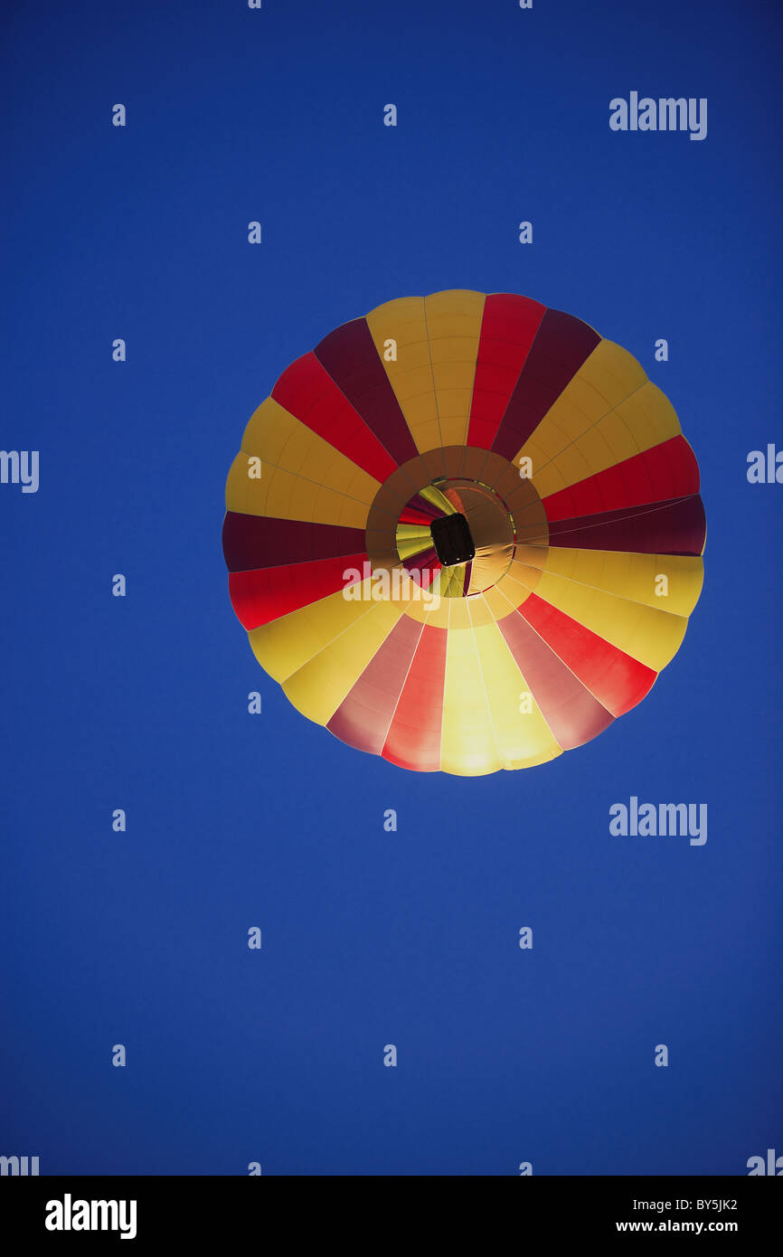 Looking straight up at a hot air balloon in flight. A colorful balloon ...