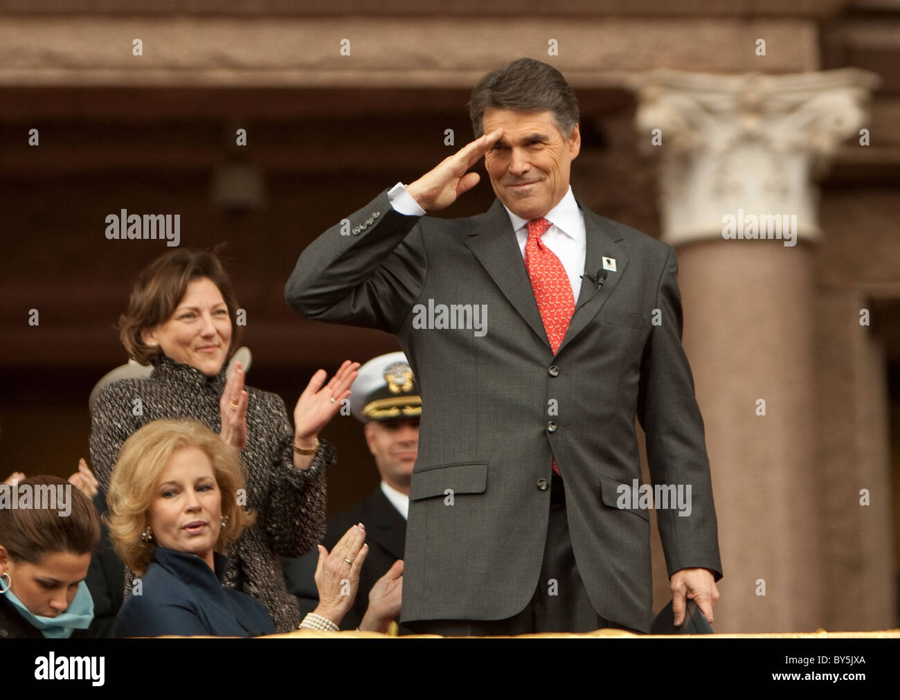 Texas Governor Rick Perry salutes the crowd after being sworn-in for ...