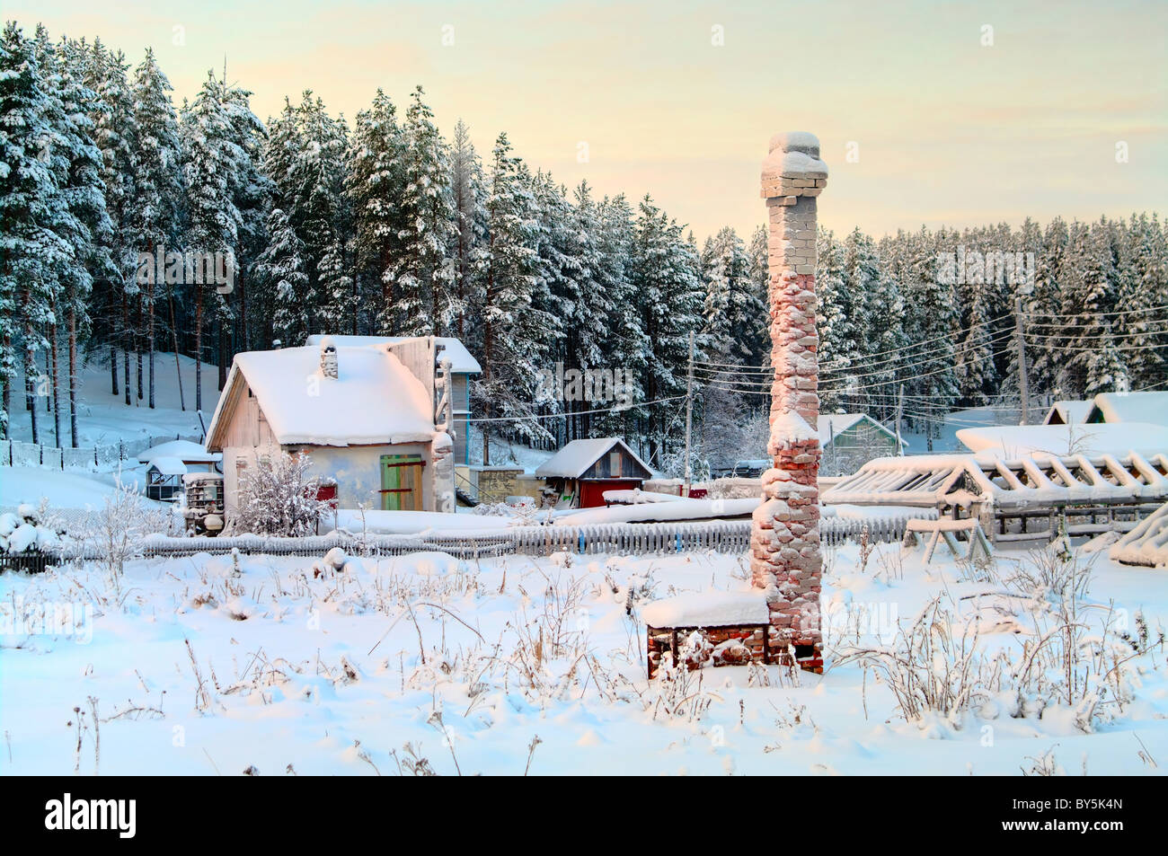 Russian wasteland in village. Winter time. Neglected place in Karelia ...