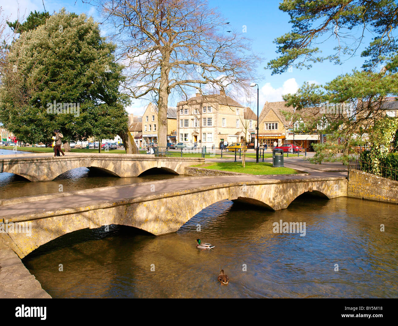 Footbridge over the river Windrush in the Cotswold village of Burton on ...