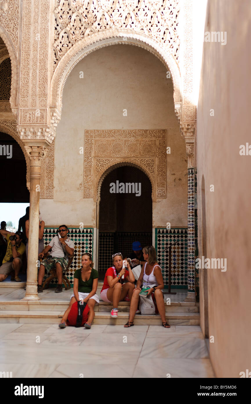 Tourists admiring the interior of the Mexuar at the Alhambra in Granada ...