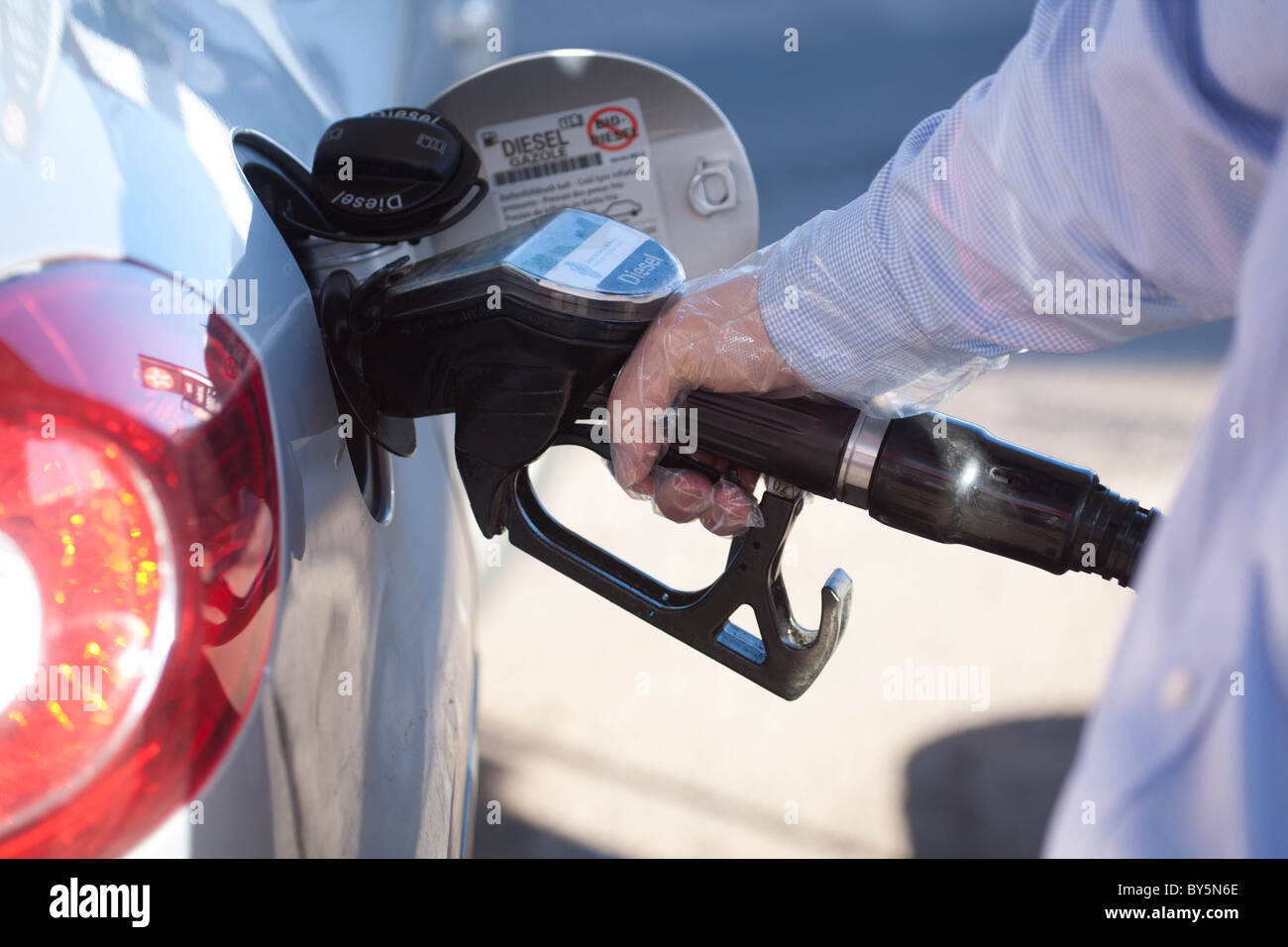 Man filling car with Diesel Stock Photo - Alamy