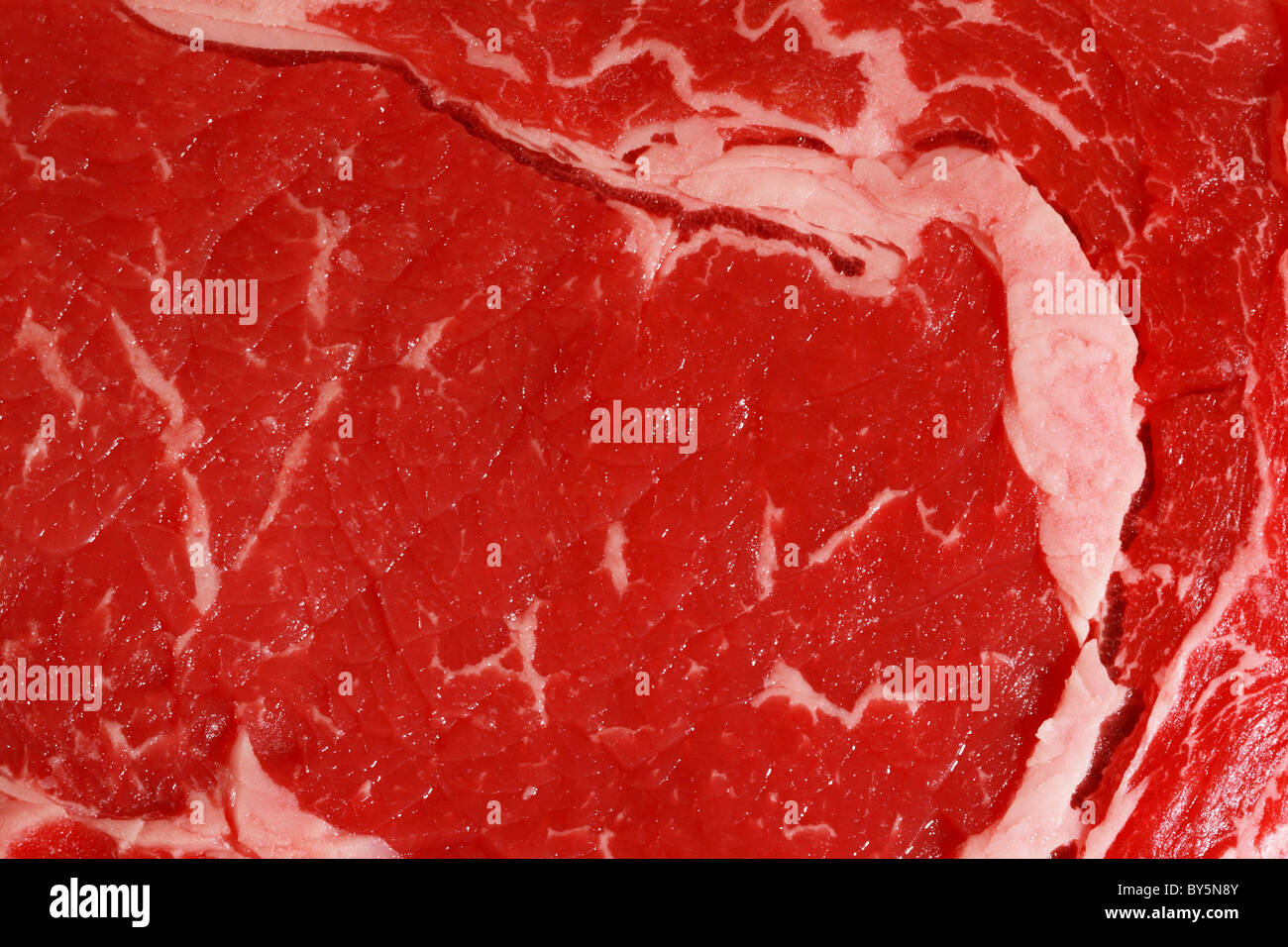 raw red black angus rib-eye steak meat macro Stock Photo - Alamy