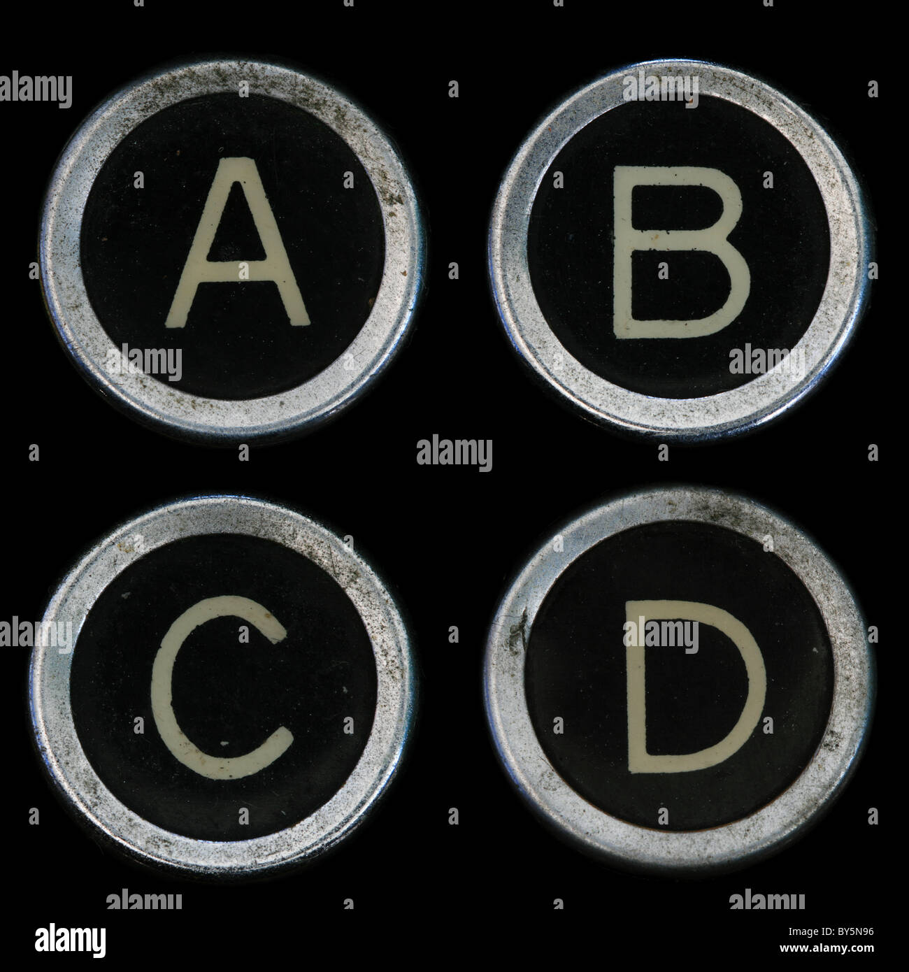 A B C D keys from old typewriter on black background Stock Photo - Alamy
