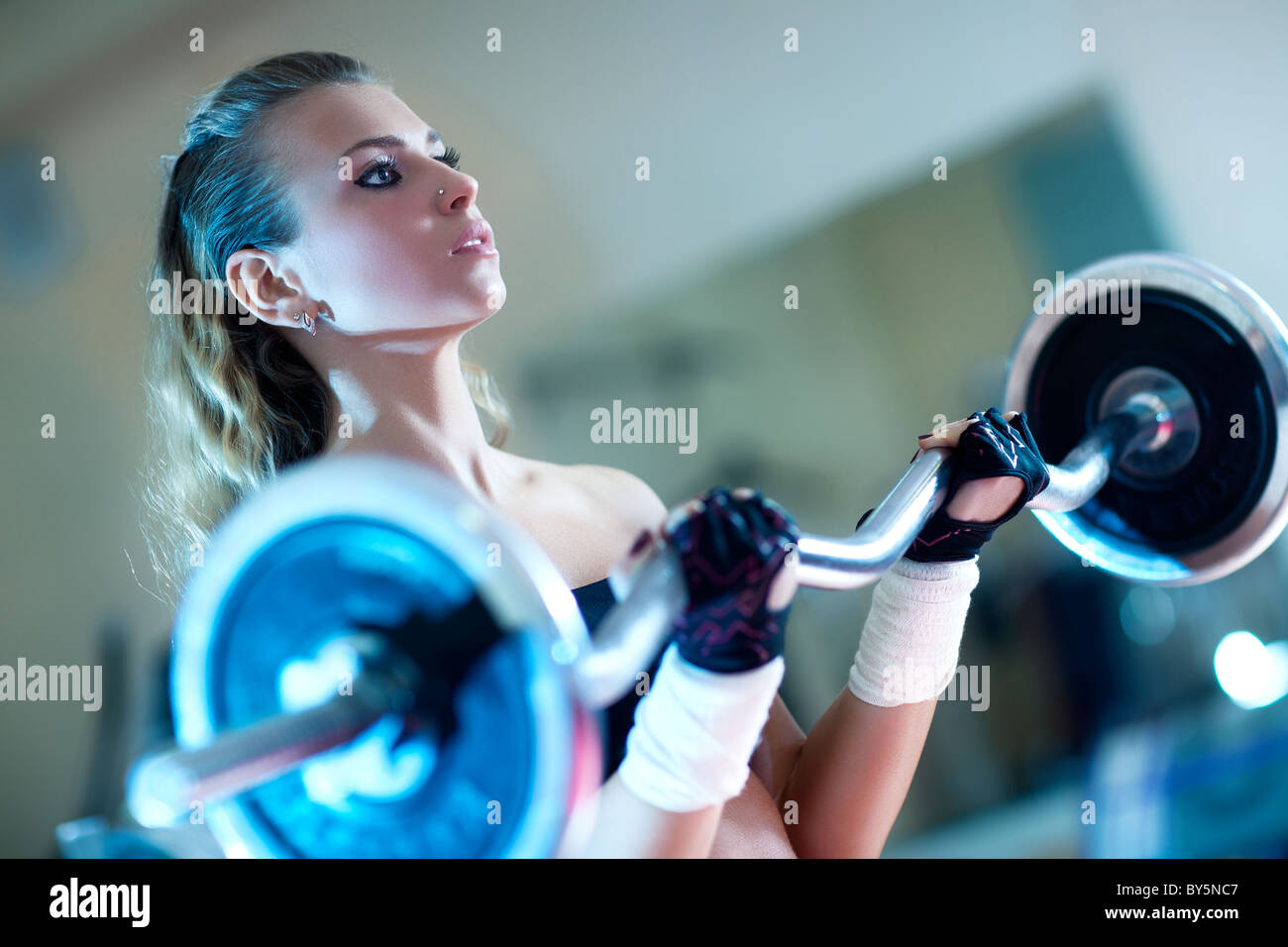 Weight training young woman portrait Stock Photo - Alamy