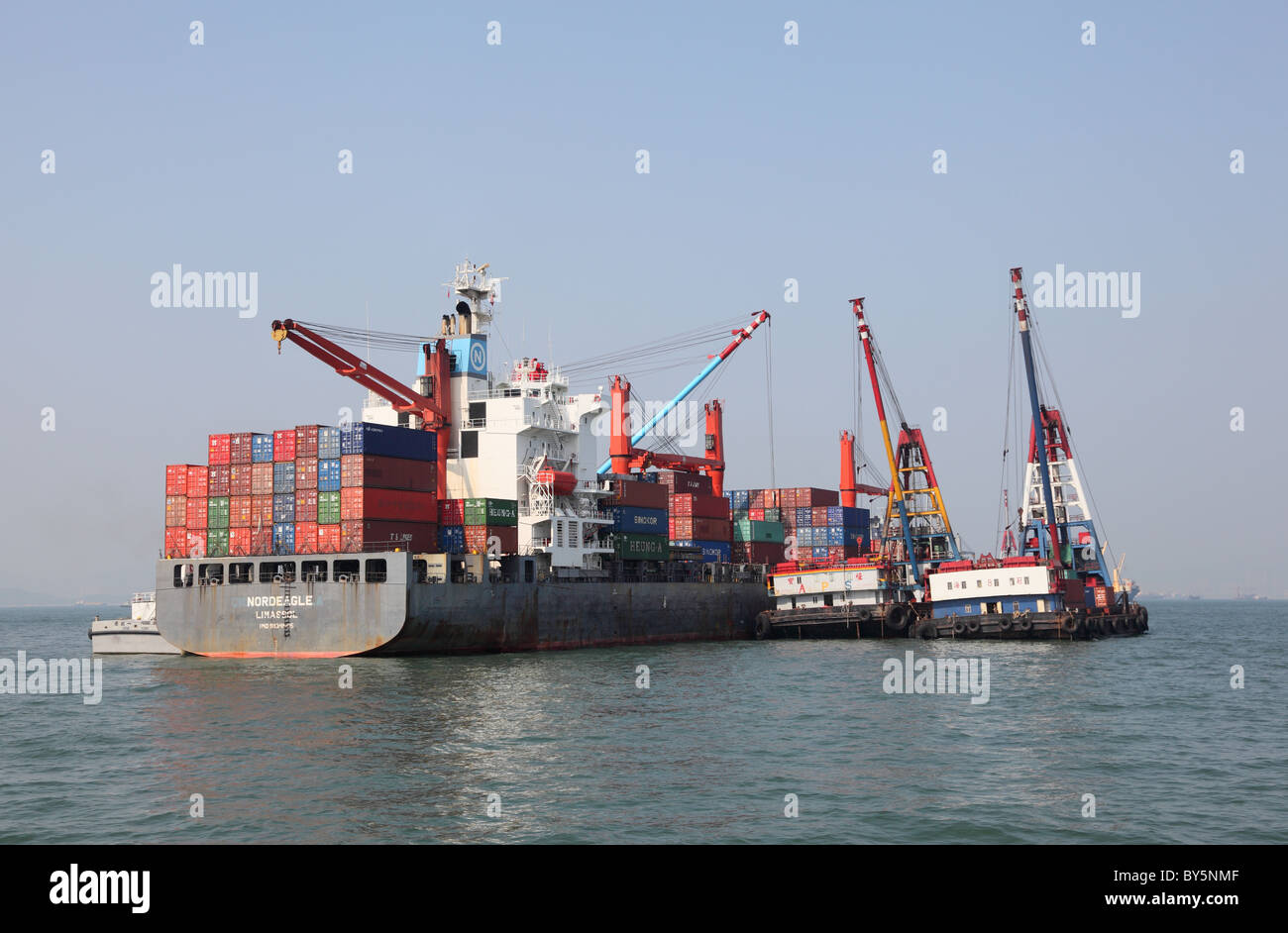 Large cargo ship unloading containers, Hong Kong Stock Photo - Alamy