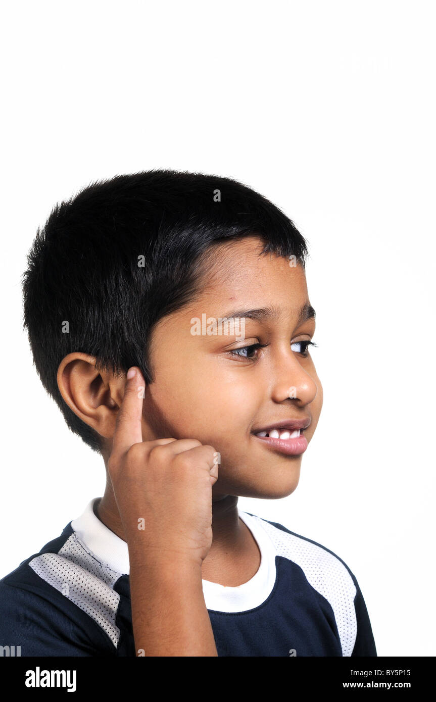 an handsome young indian kid thinking about something Stock Photo - Alamy