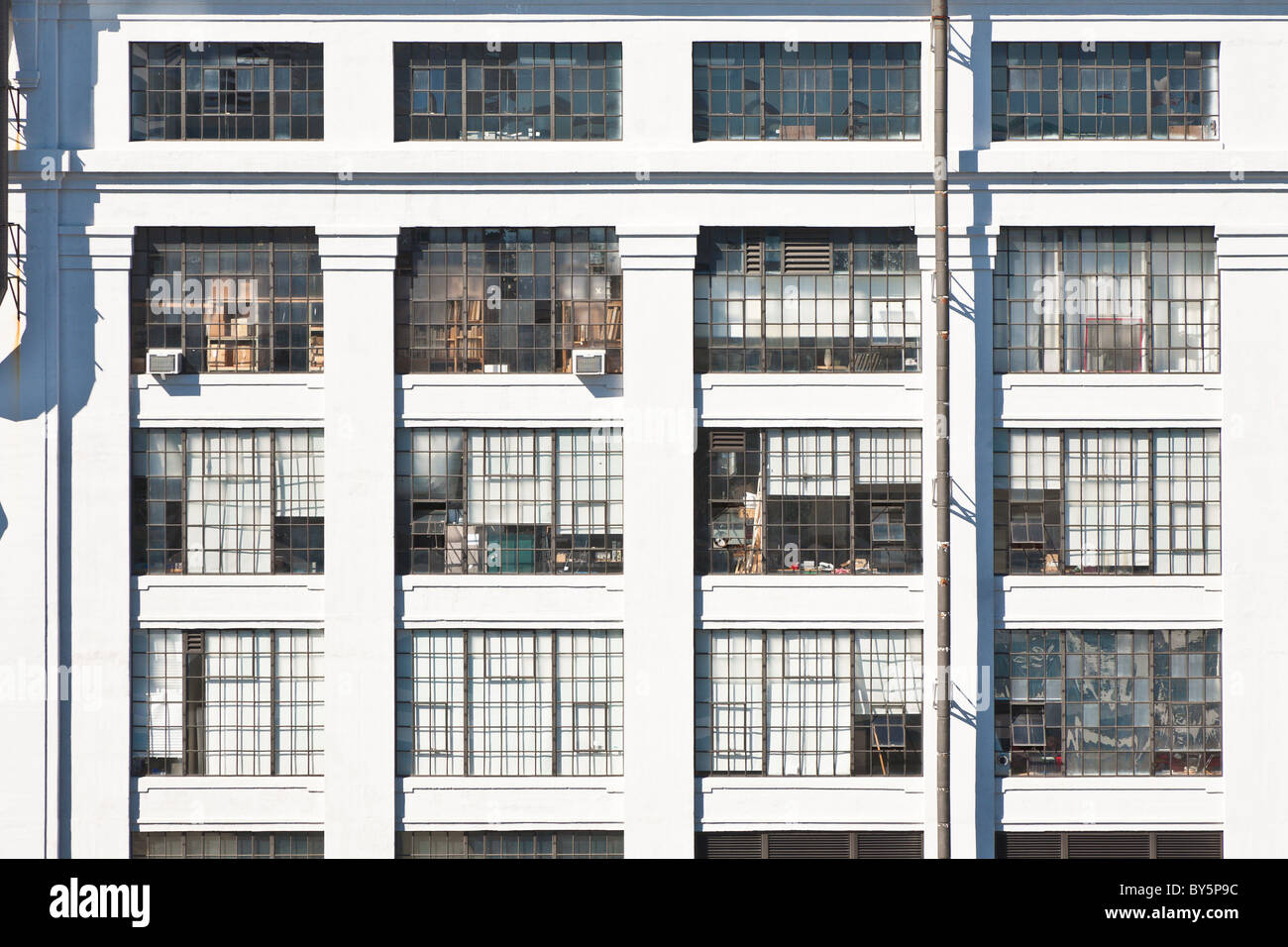 Old commercial warehouse and office building wall of windows Stock ...