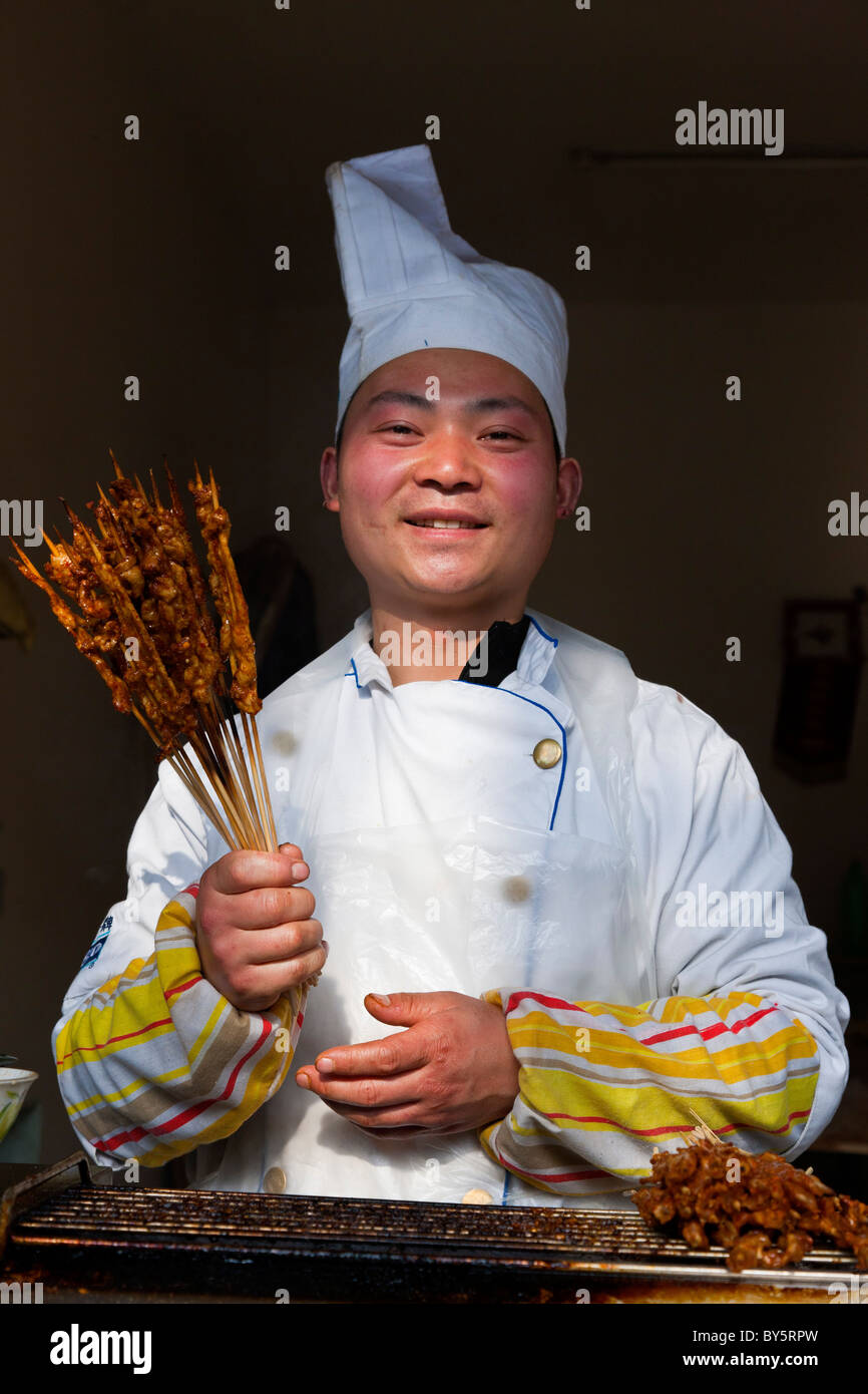 Street kebab fast food seller in the ancient town of Huanglongxi near ...