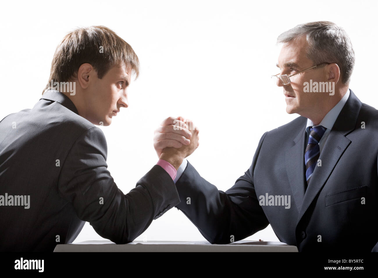 Portrait of two partners fighting and looking at each other Stock Photo ...