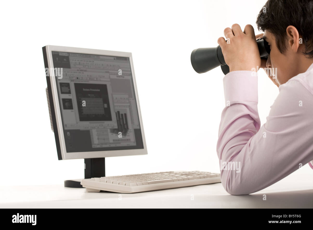 Photo of white collar worker with binoculars looking at monitor of ...