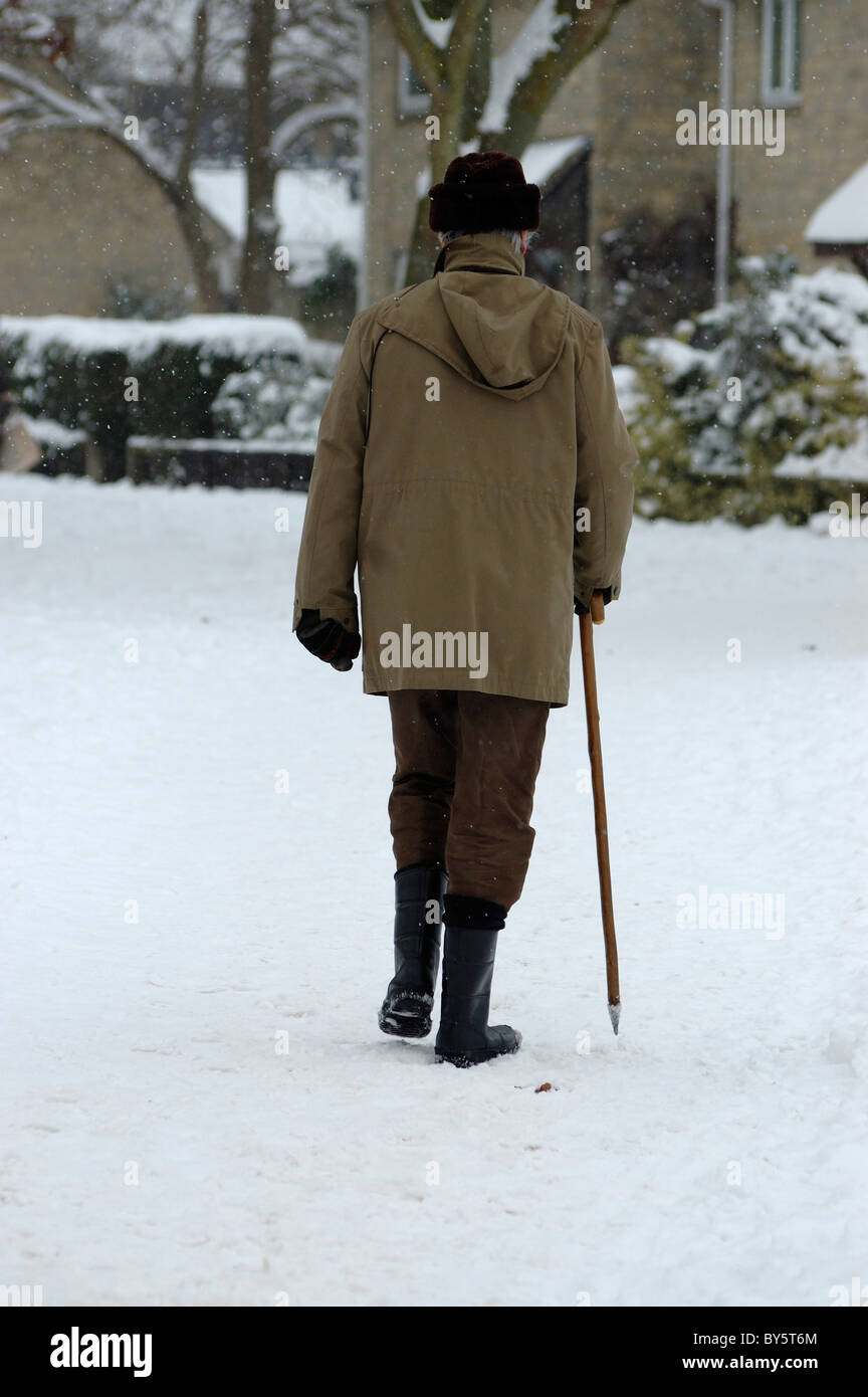Man in the snow Stock Photo - Alamy