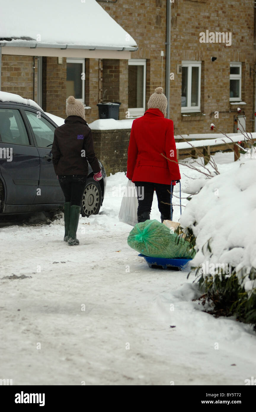 Two people in the snow Stock Photo - Alamy