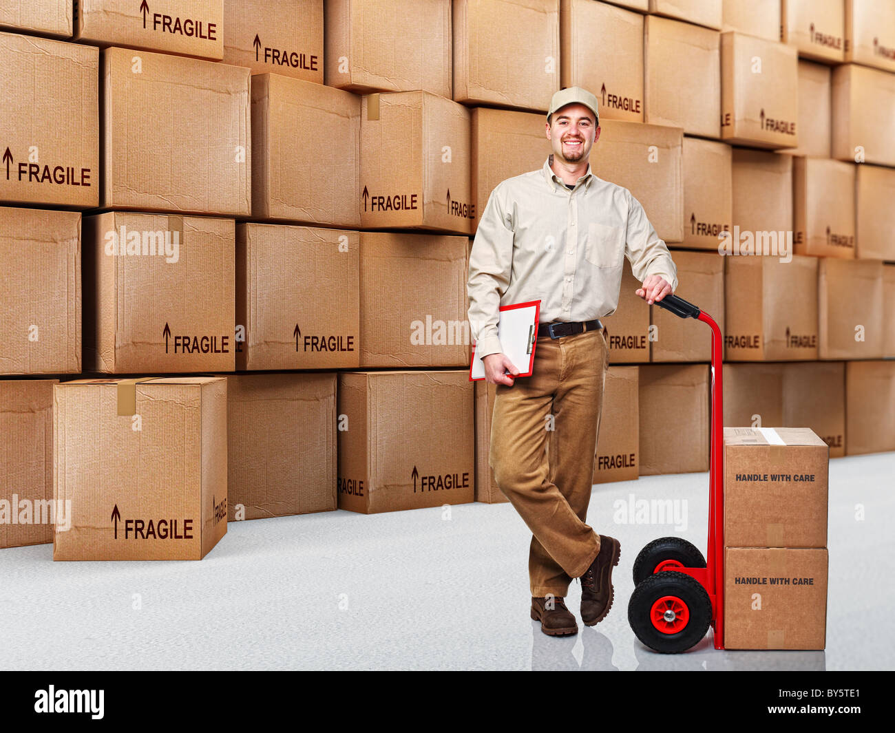delivery man at work and 3d boxes background Stock Photo - Alamy