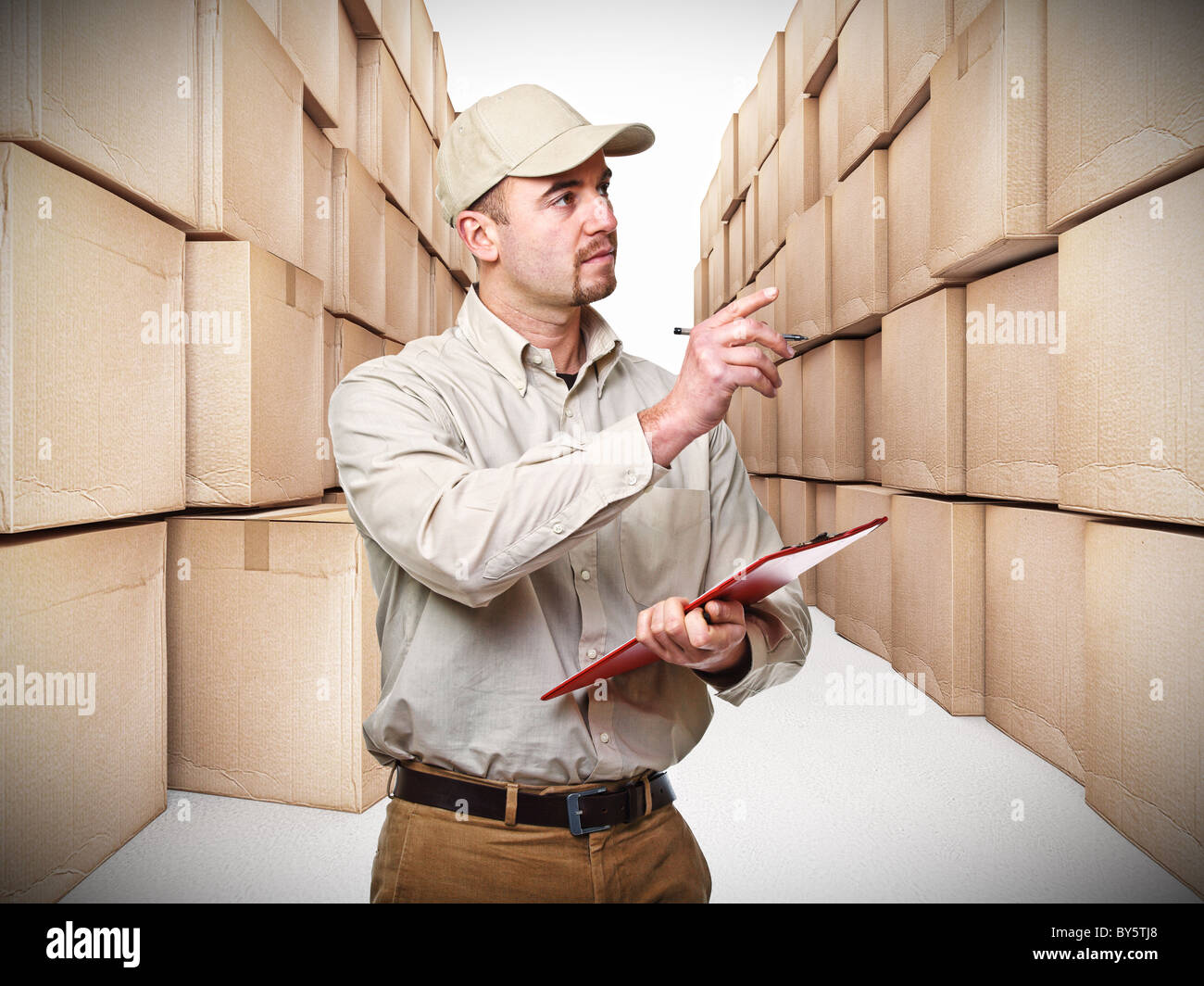 delivery man at work and 3d boxes background Stock Photo - Alamy