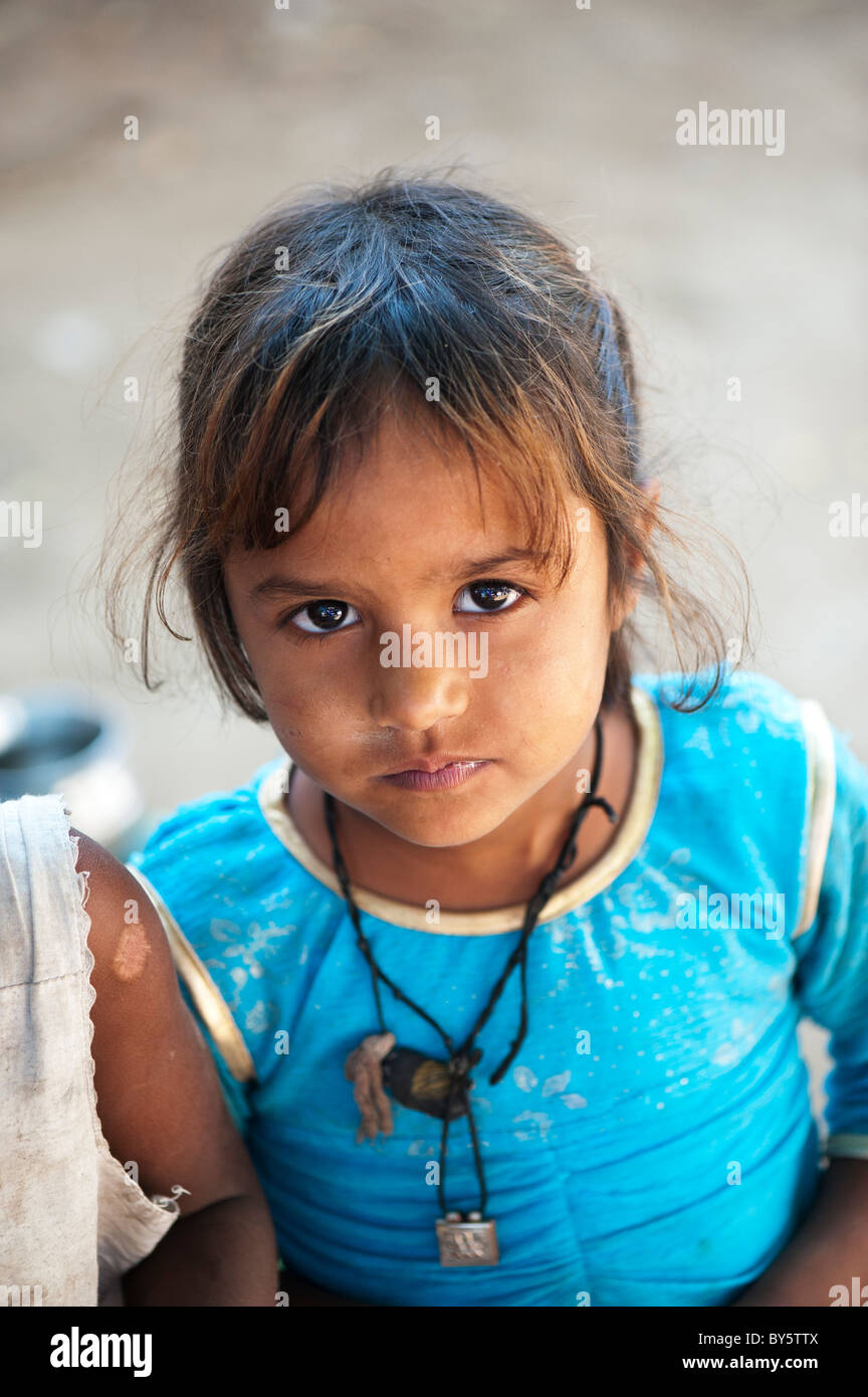 Young poor lower caste Indian street girl from Utter Pradesh looking up ...