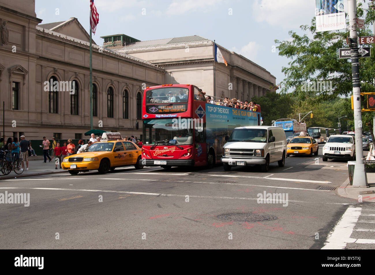 New York City street scene on 5th Avenue with hop on & hop off tourist ...