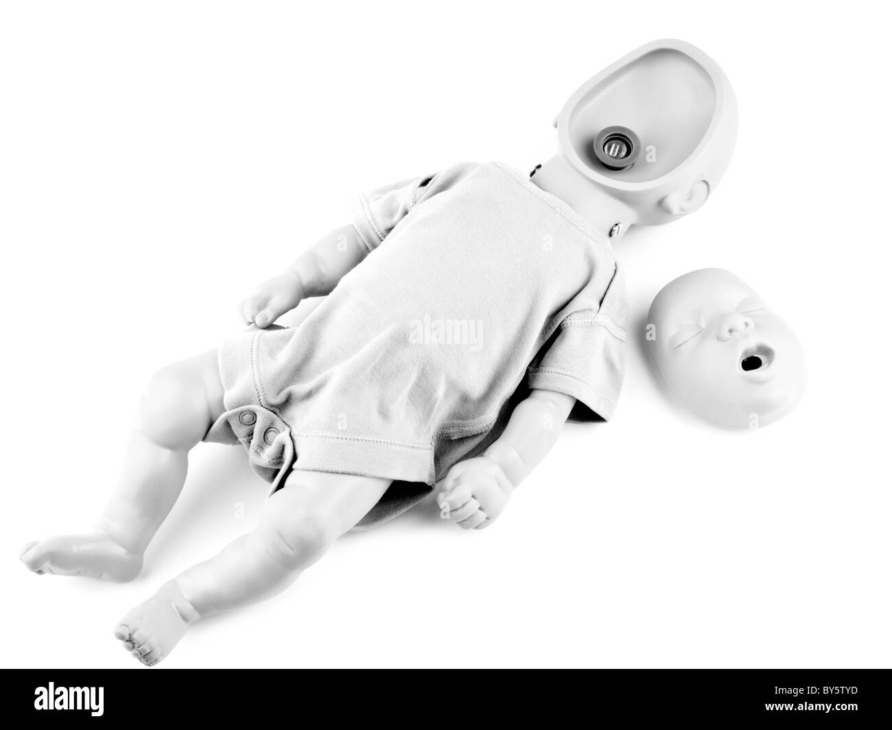 Black and white picture of first aid traning infant dummy on white ...