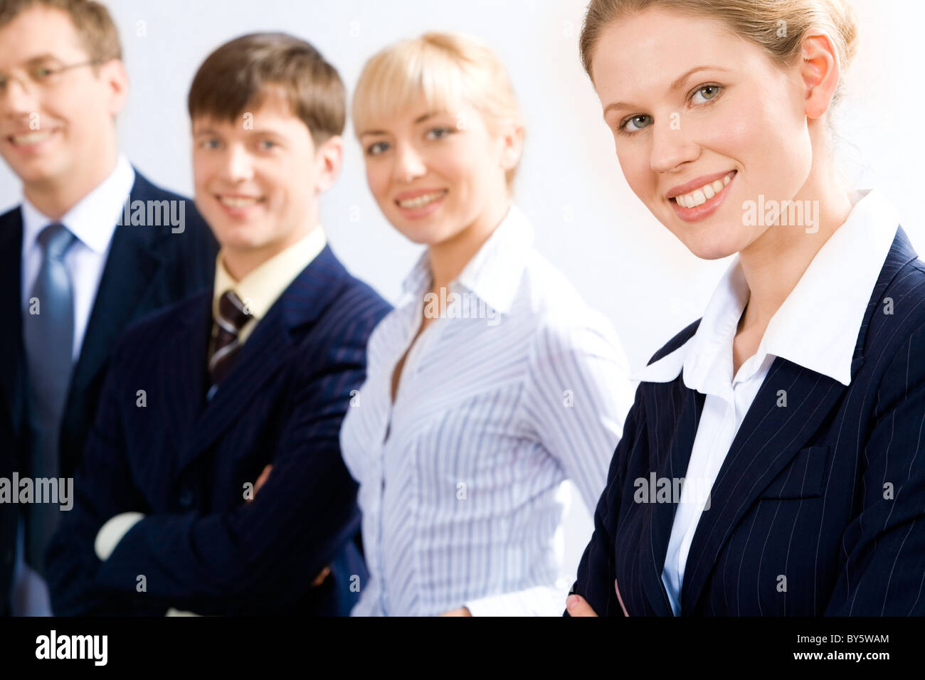 Portrait of business leader with her working team Stock Photo - Alamy
