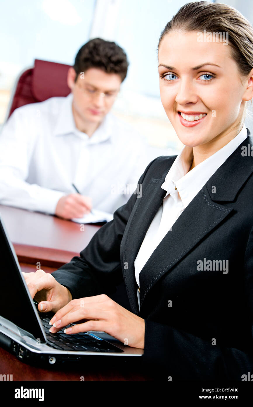 Portrait of professional typing a text in the office Stock Photo - Alamy
