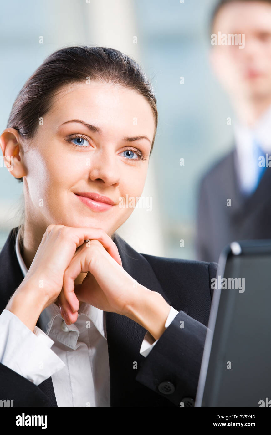 Beautiful business woman with pen in her hand isolated on a white ...