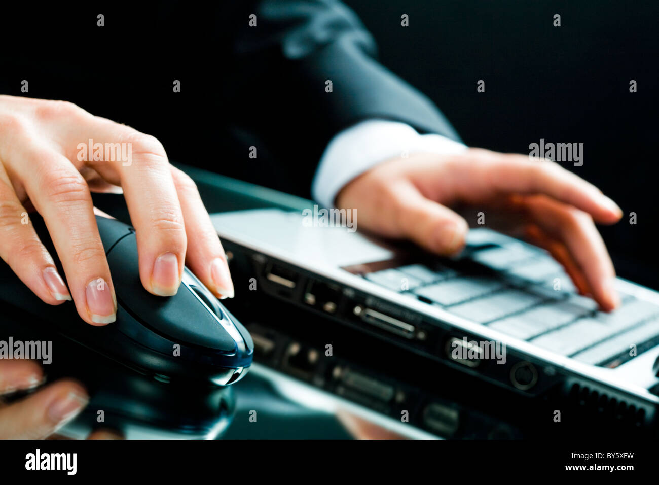 Image of human hands working on the laptop and computer mouse Stock ...