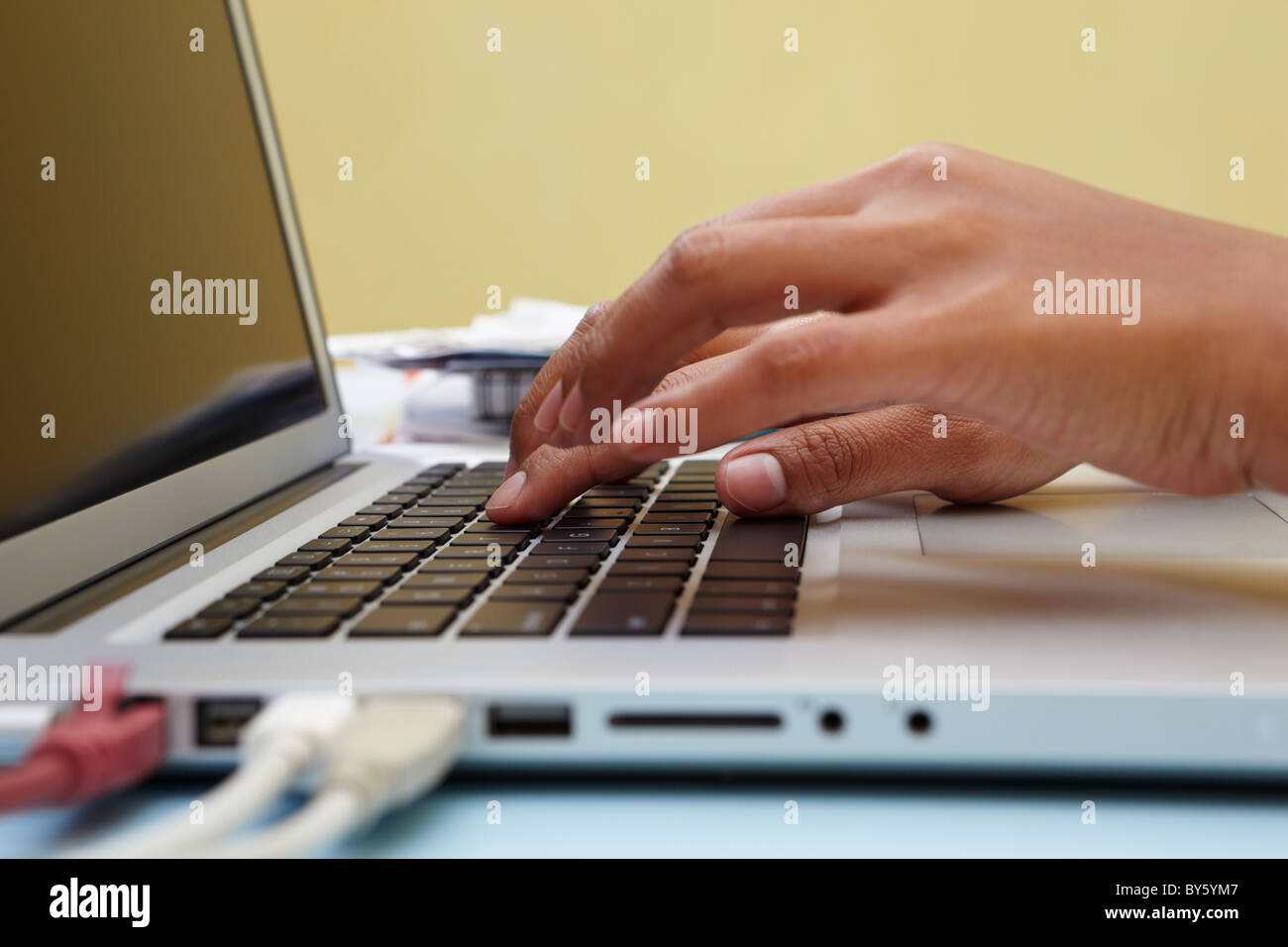 Hand using laptop in office, unrecognizable people Stock Photo - Alamy