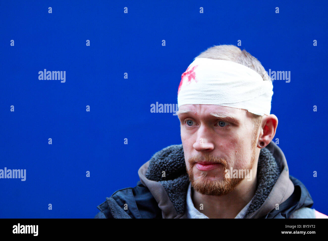 Protesters with fake head injuries outside New Scotland Yard after a ...