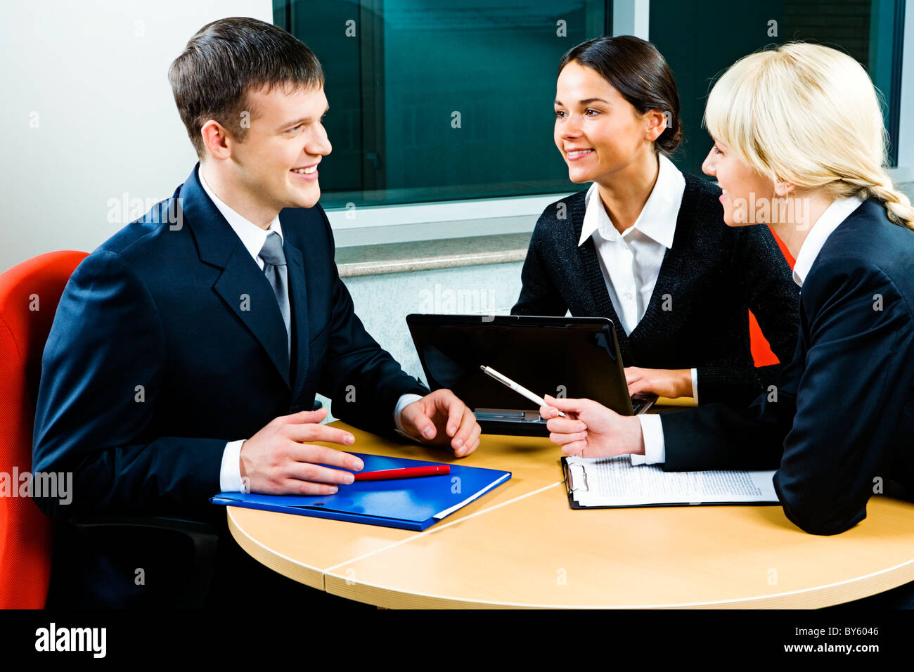 Caucasian man telling work colleagues hi-res stock photography and ...