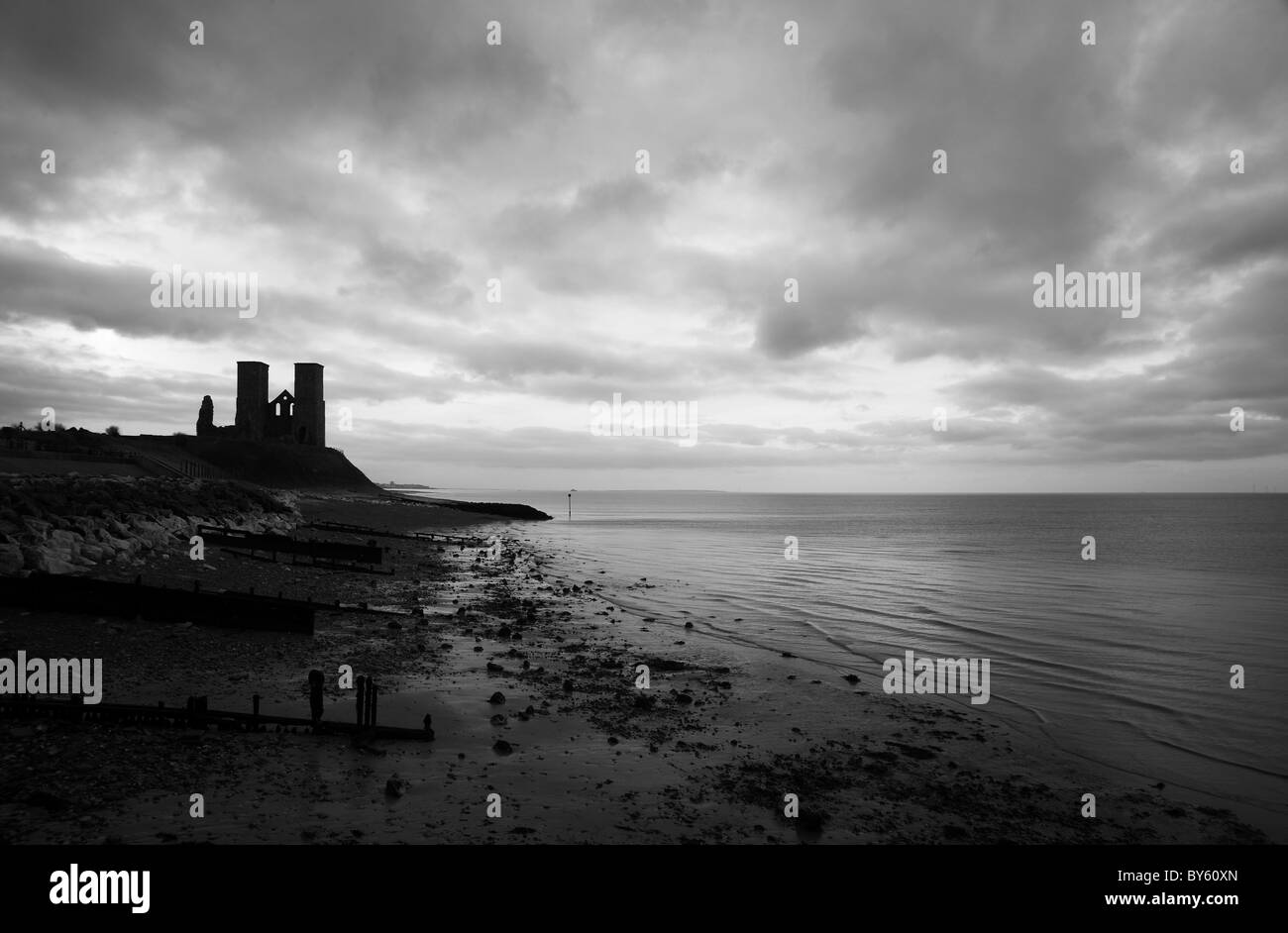 Reculver Towers in silhouette with sea and Sky Stock Photo - Alamy