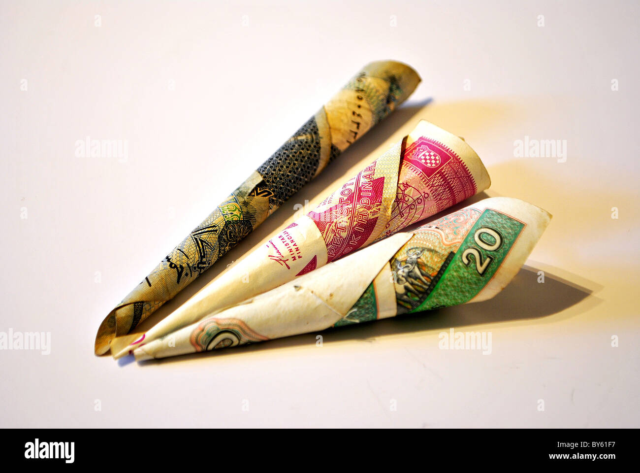 paper money and coins on white background Stock Photo - Alamy