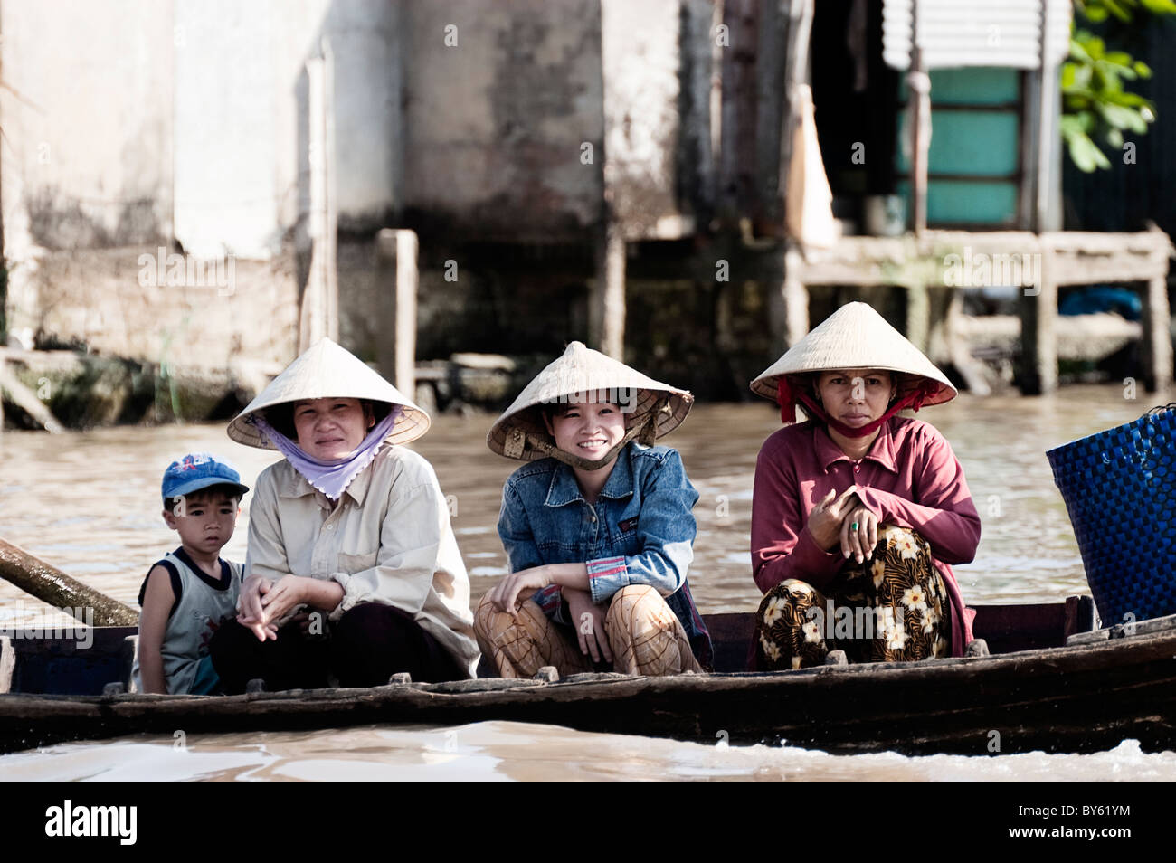 three Women and one children In A Rowing Boat Stock Photo - Alamy