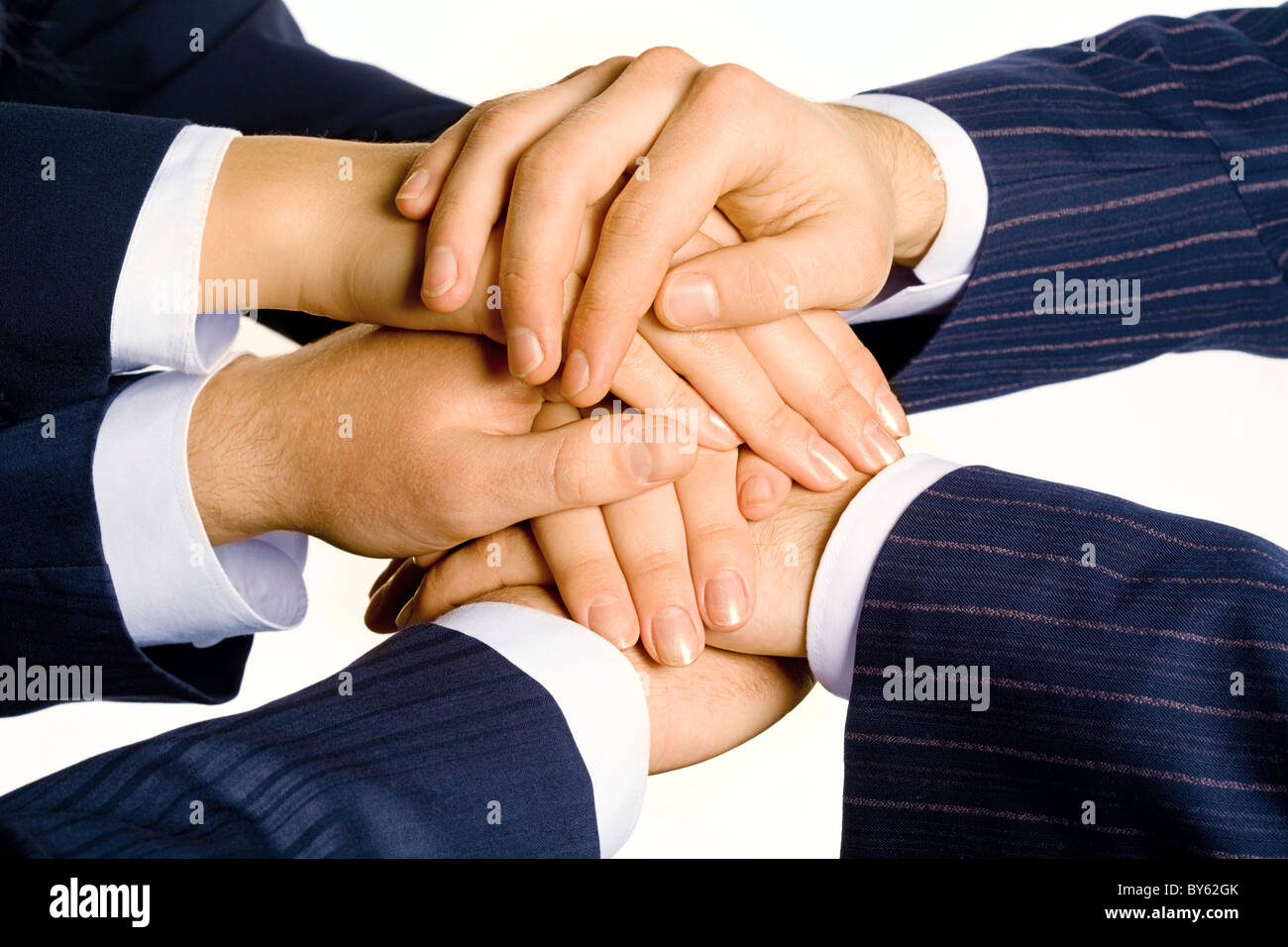 Photo of human hands on top of each other isolated on a white ...