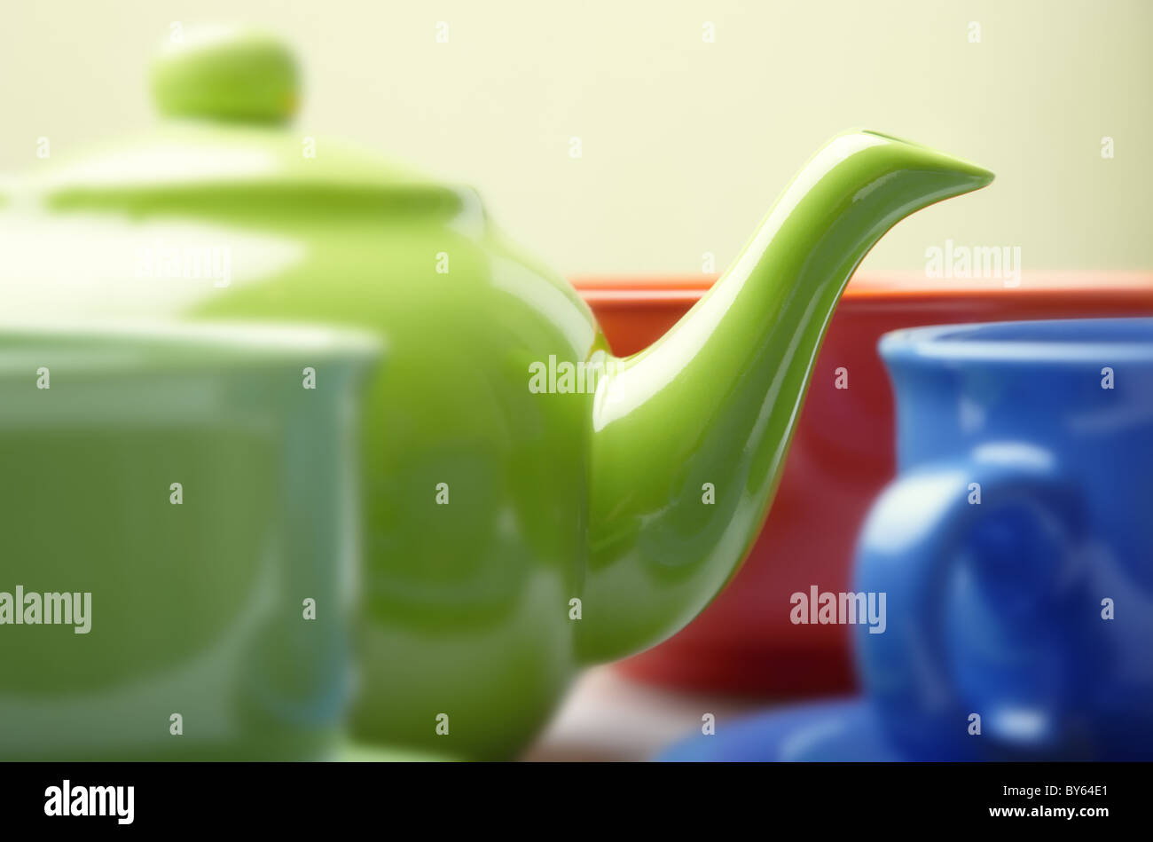 Close-up photo of the fragment of tea service consisting of teapot and ...