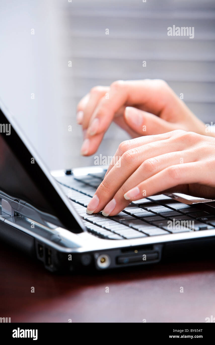 Image of hands typing a letter on the keyboard of laptop Stock Photo ...
