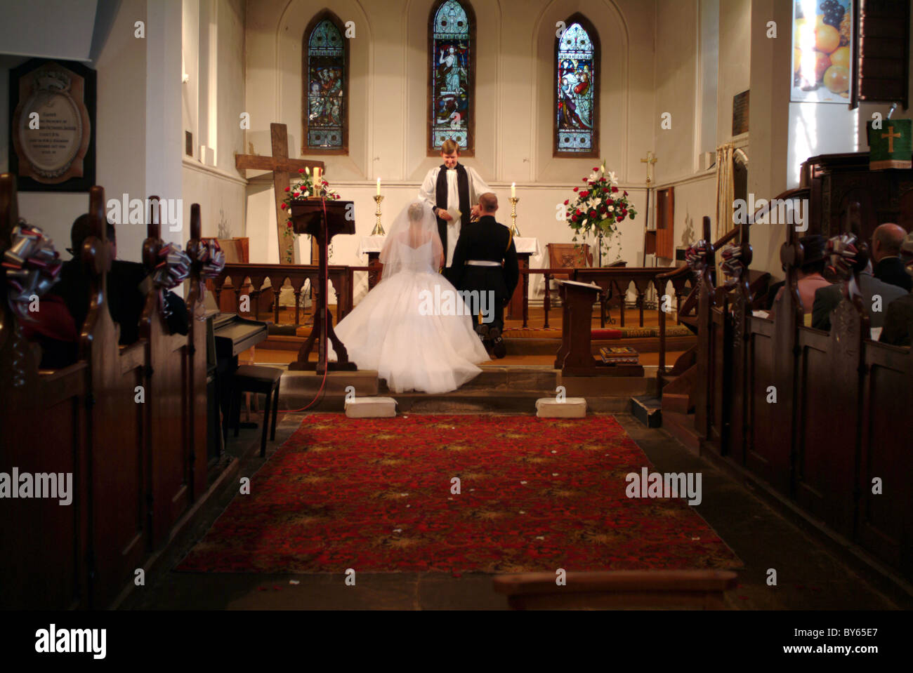 Bride and groom at the altar Stock Photo - Alamy