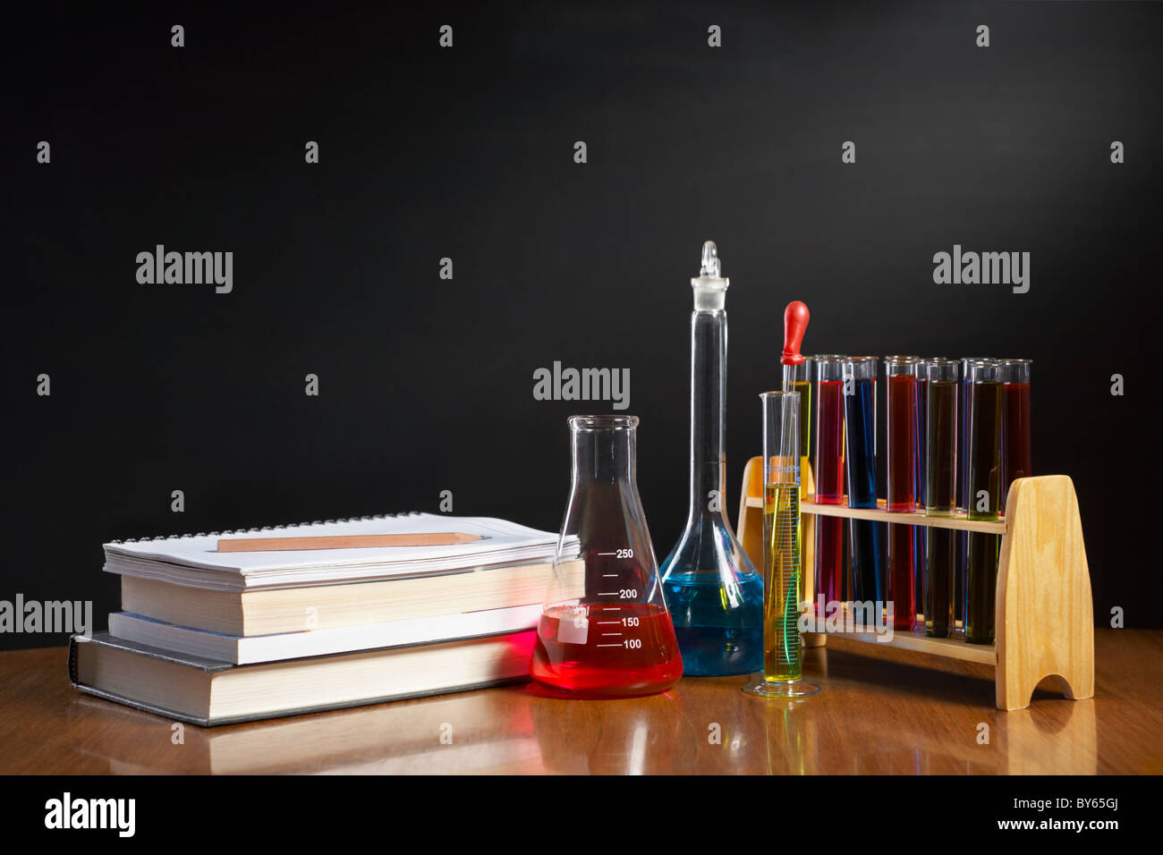 Chemistry class concept with pile of books and chemical solution Stock ...