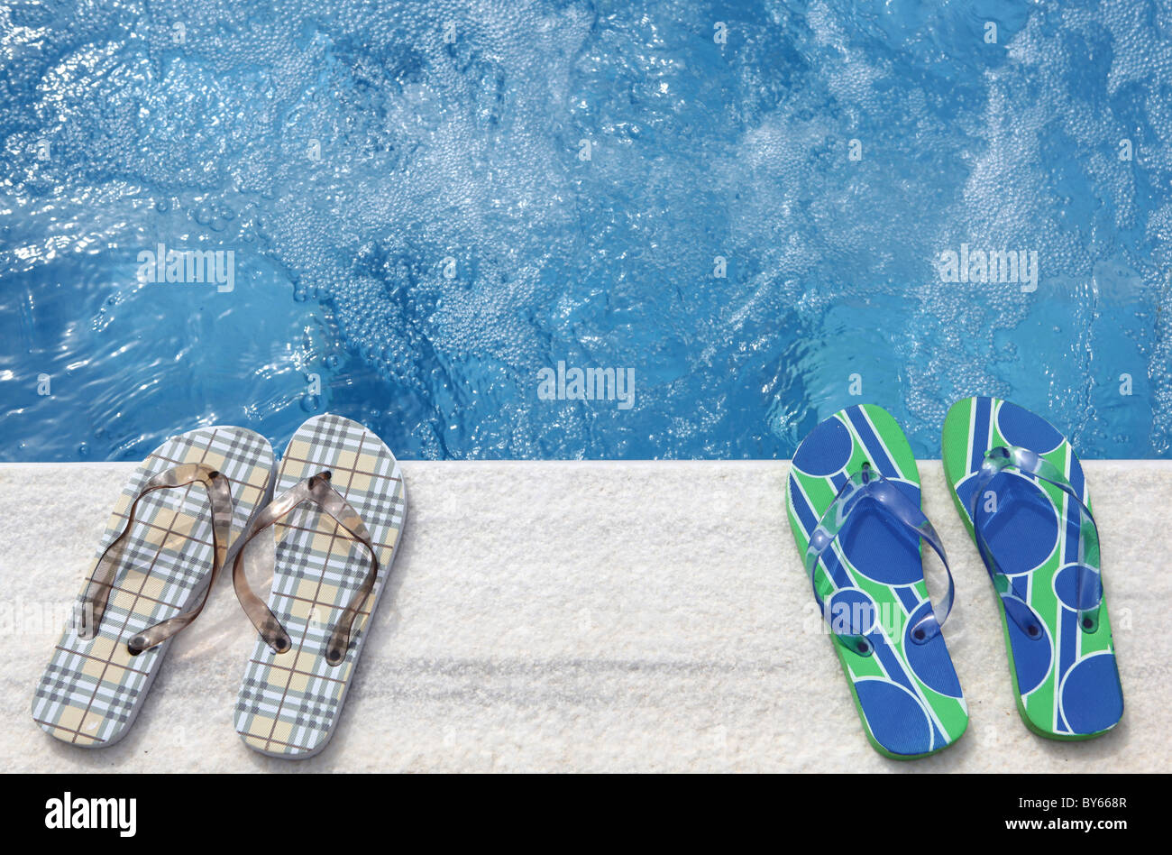 Flip flops beside a swimming pool Stock Photo - Alamy