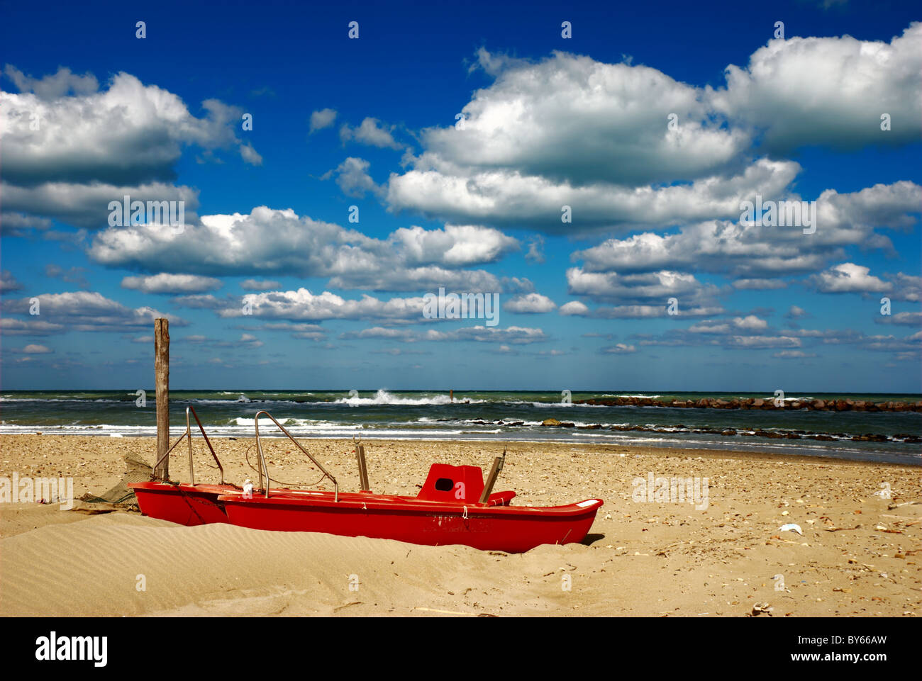 Little row boat on a sand beach of Adriatic sea Stock Photo - Alamy