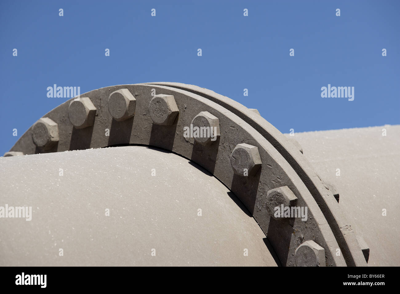 An industrial pipe joint held together by bolts Stock Photo - Alamy