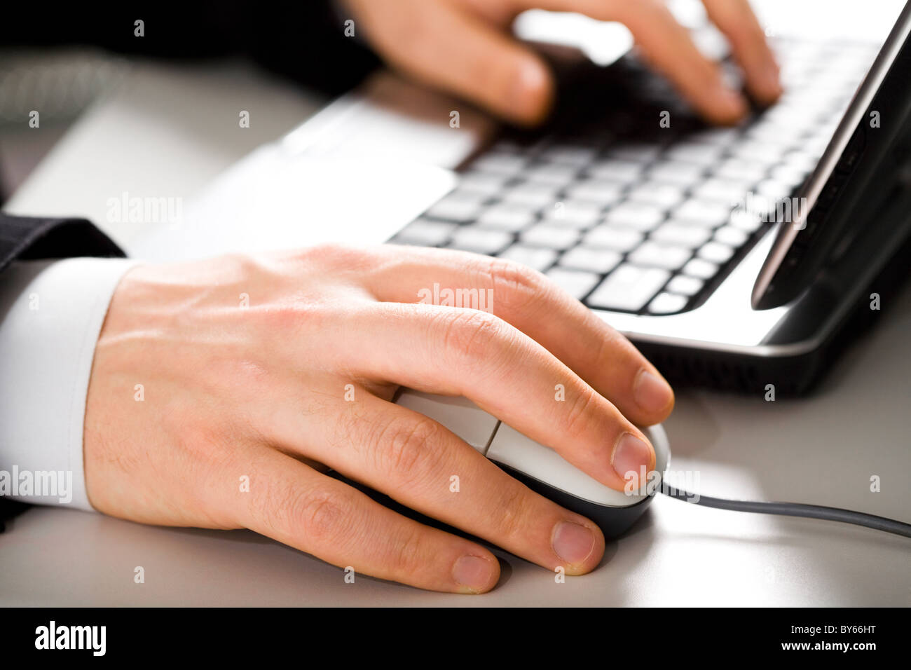 Busy business man doing some computer work Stock Photo - Alamy