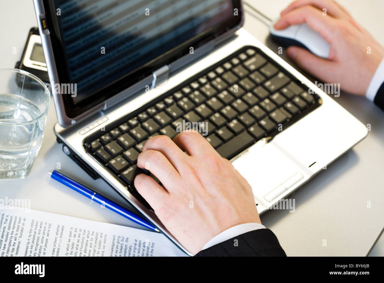 Image of male hands working on the laptop Stock Photo - Alamy