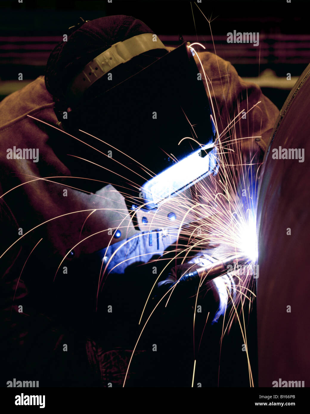 A welder welding the top on a pressure vessel Stock Photo - Alamy