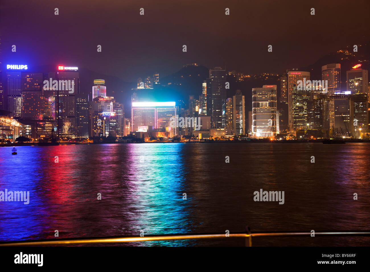 The amazing Hong Kong skyline at night from Kowloon lights glowing on Victoria Harbour Stock ...