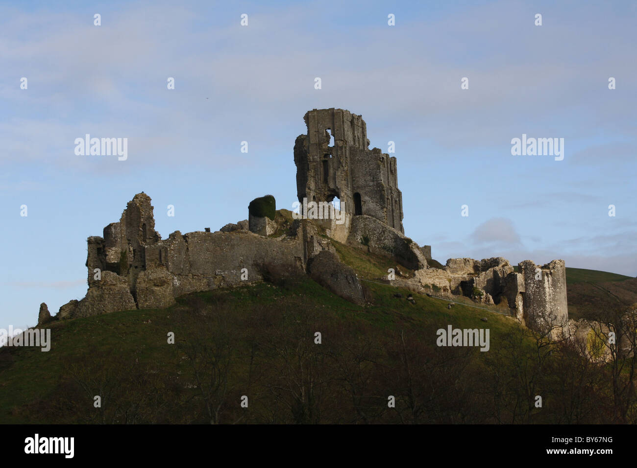 Corfe Castle in January with blue sky. Iconic hill castle destroyed by ...
